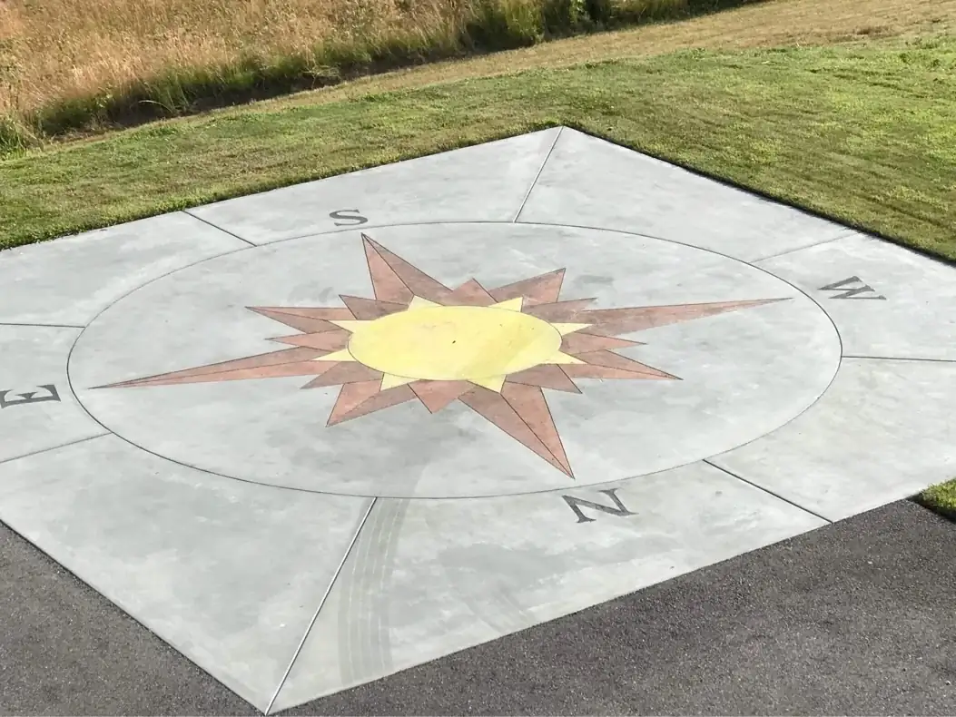 Smooth Finish Concrete Patio with a Stained Compass Rose Design in ...